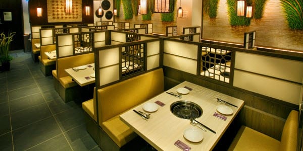 How Restaurants Welcome Solo Diners with Booth Dining Tables